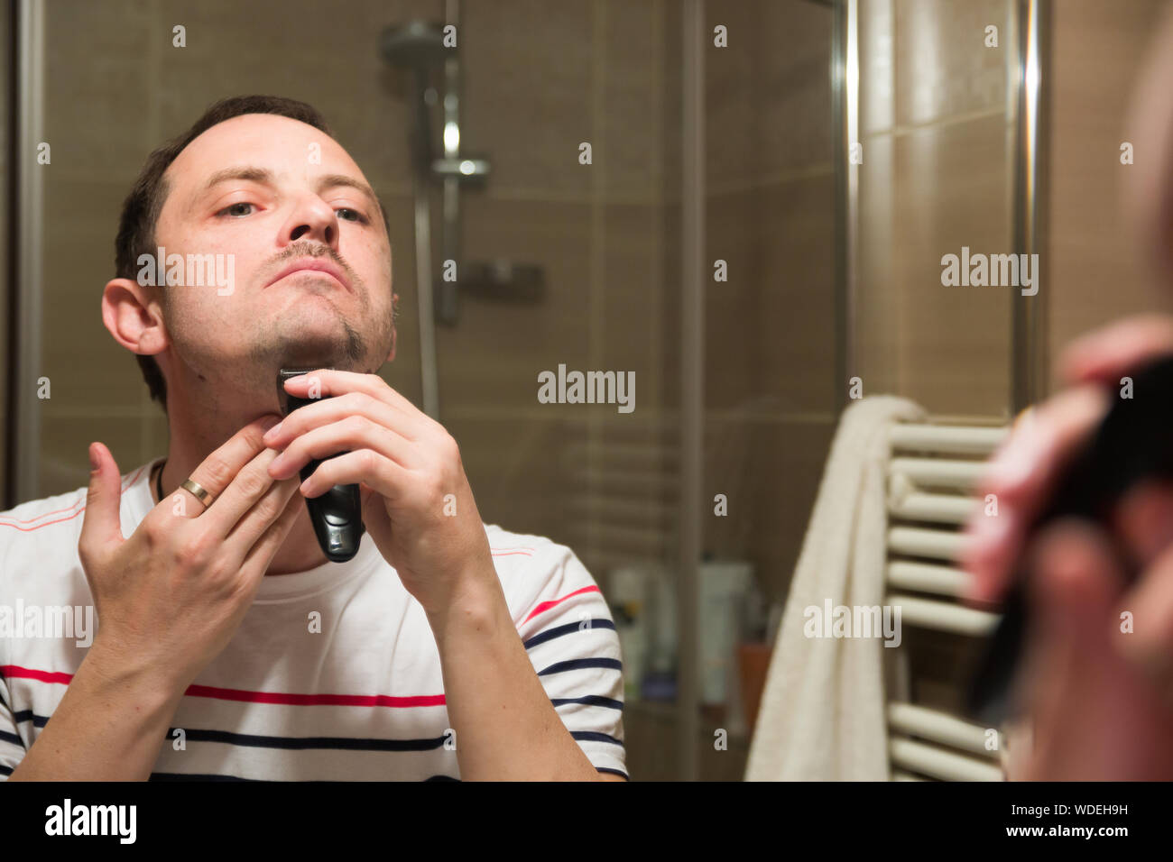 Trimming beard in bathroom hi-res stock photography and images - Alamy