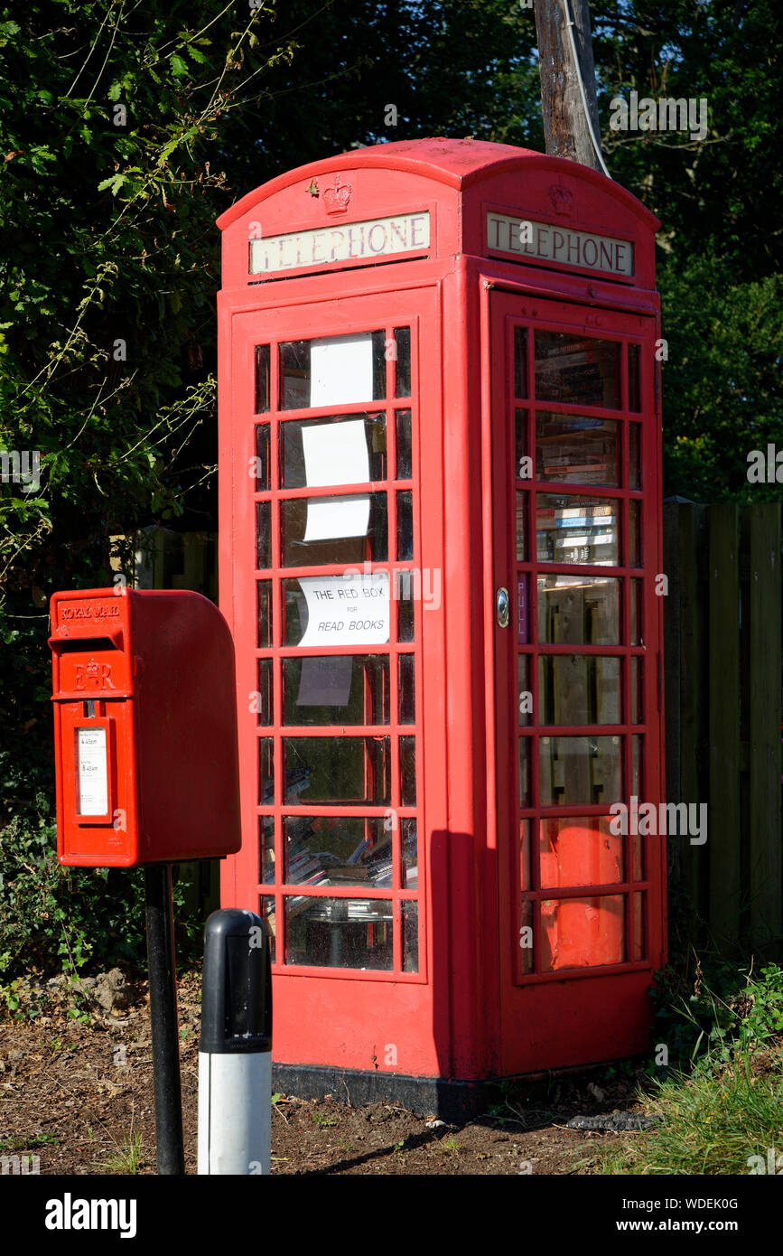 Disused old British Telecom red phonebox that is now used as a book ...