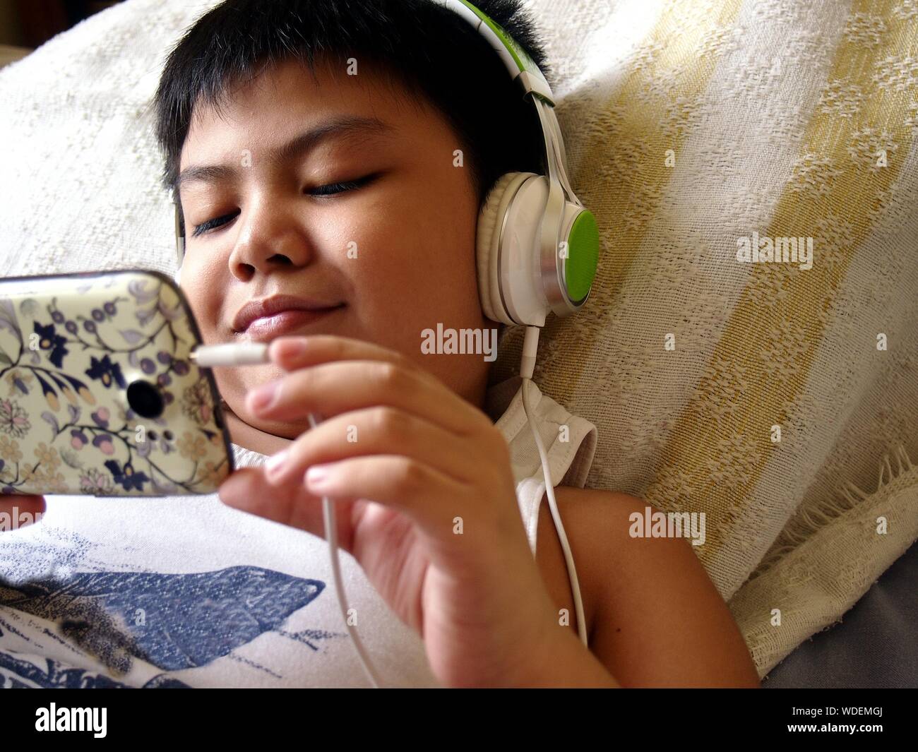 Boy using headphones hi-res stock photography and images - Alamy