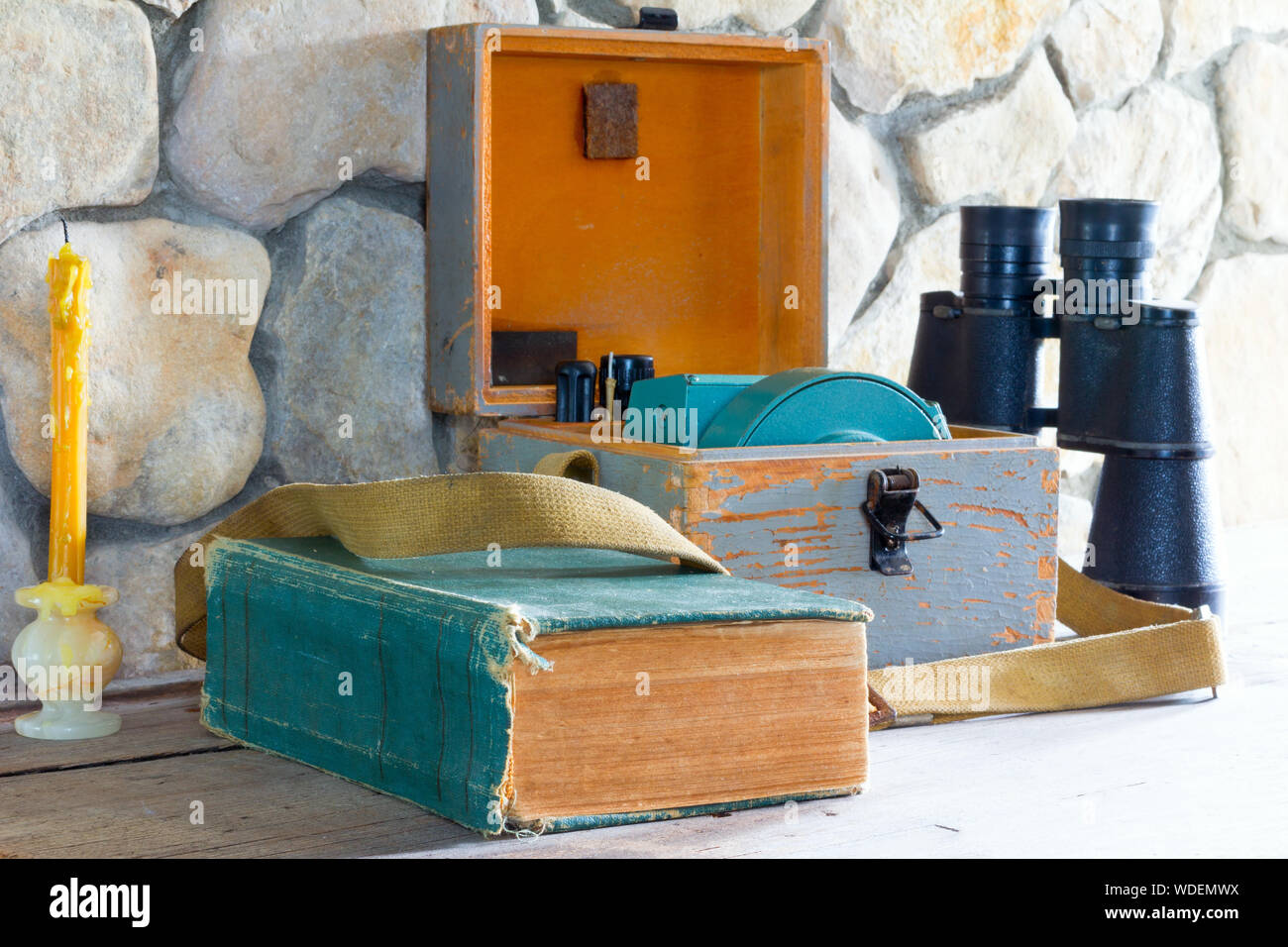 old book measuring device in a wooden case, binoculars and wax candle ...