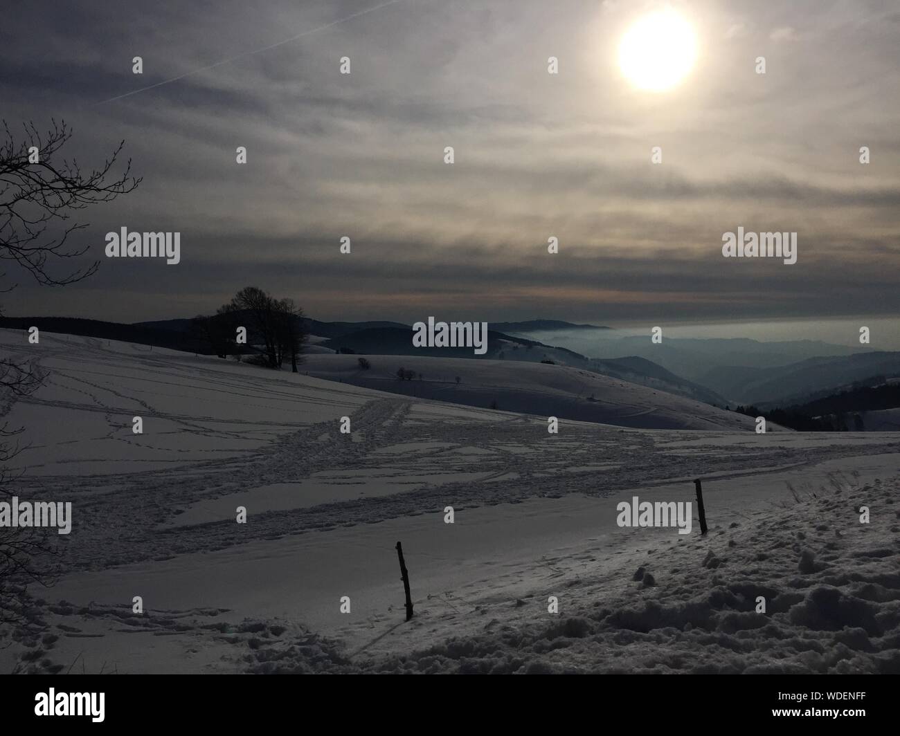 Sun covered with clouds hi-res stock photography and images - Alamy