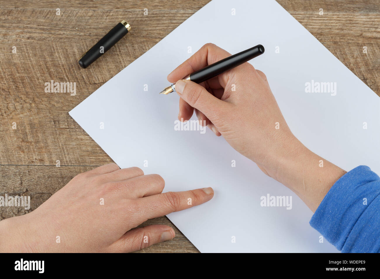 With pen and paper hi-res stock photography and images - Alamy