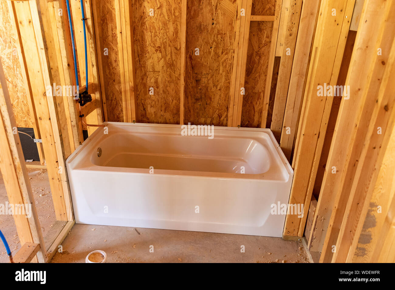 Bath tub in bathroom of new house construction Stock Photo - Alamy