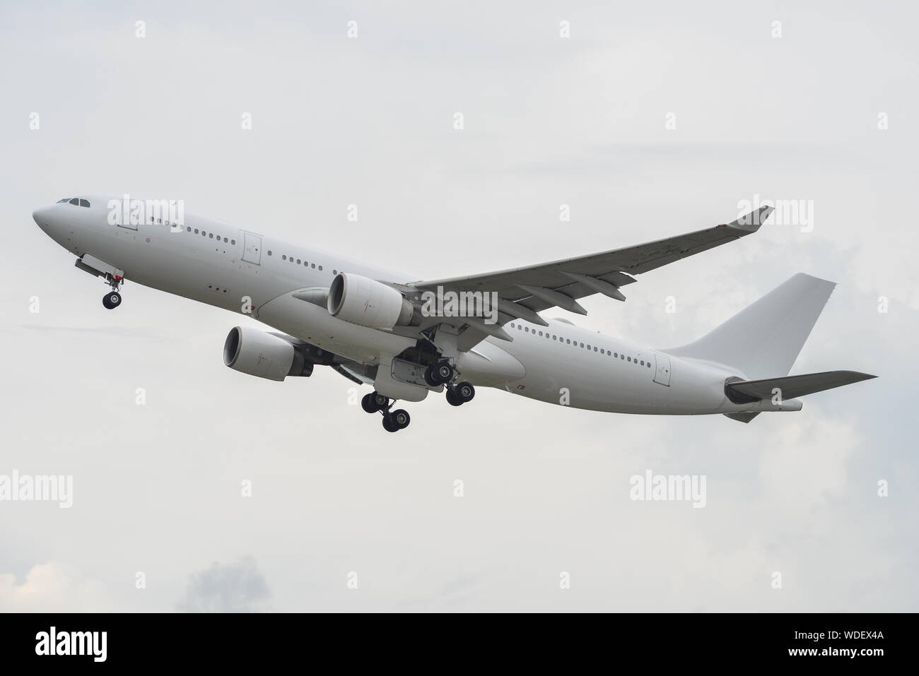 Passenger airplane taking-off from international airport Stock Photo ...