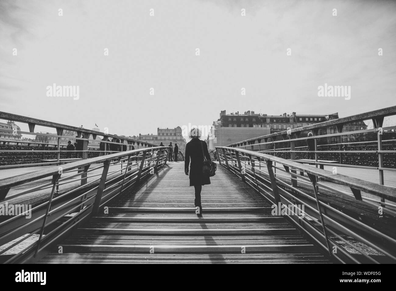 Rear view woman bridge city hi-res stock photography and images - Alamy