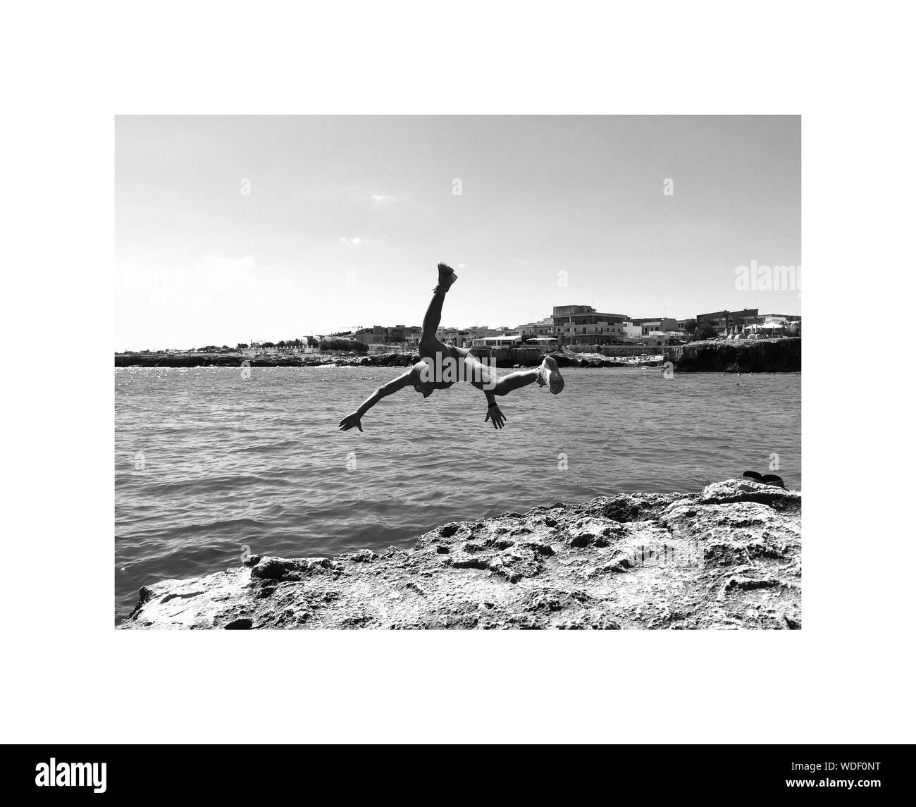 Man diving into water Black and White Stock Photos & Images - Alamy