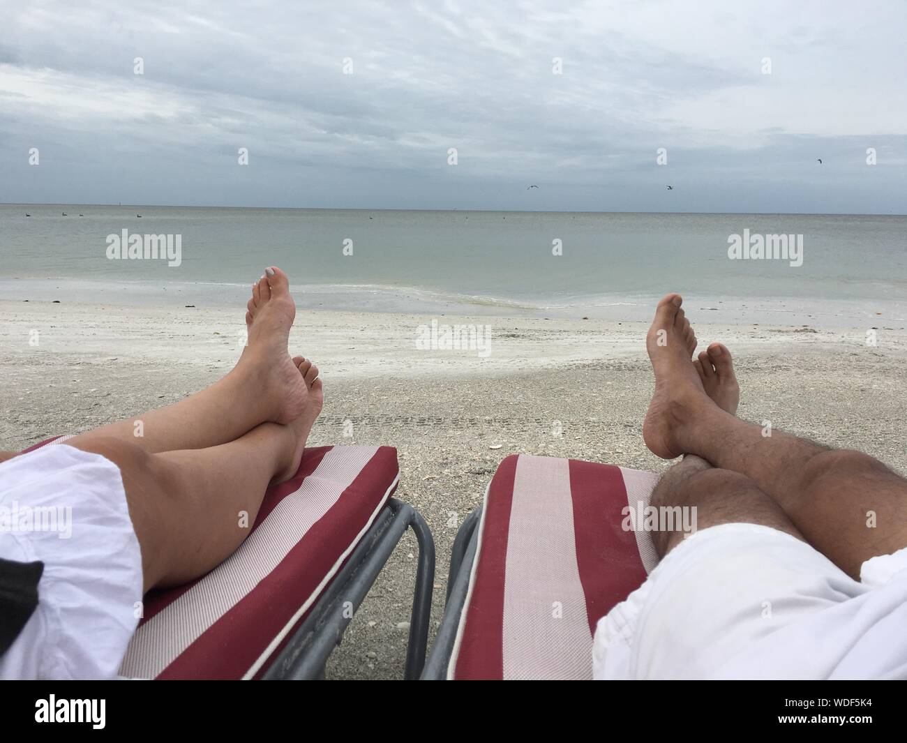 Two people in beach chairs hi-res stock photography and images - Alamy