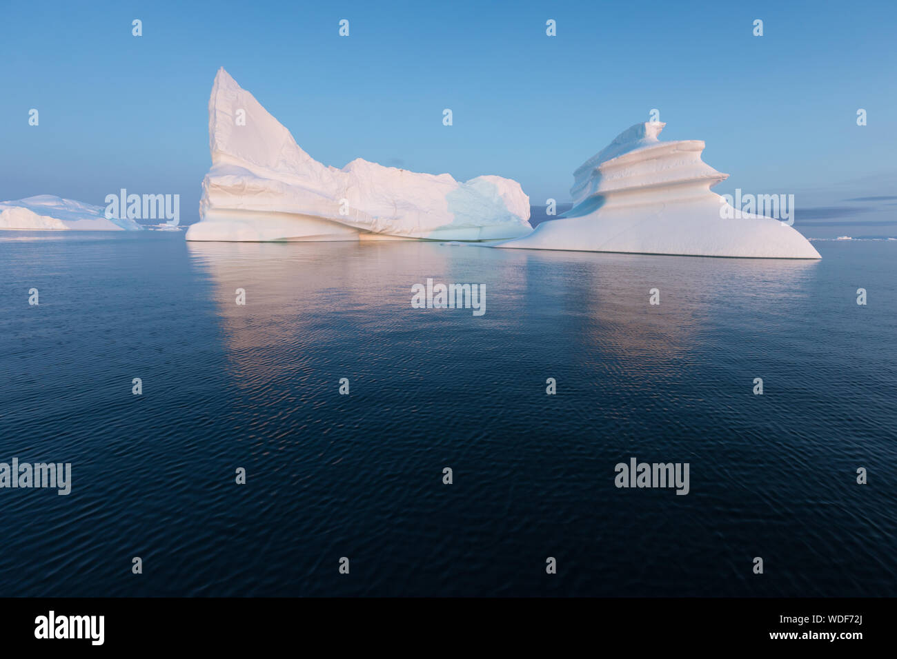 Iceberg at sunset. Nature and landscapes of Greenland. Disko bay. West ...