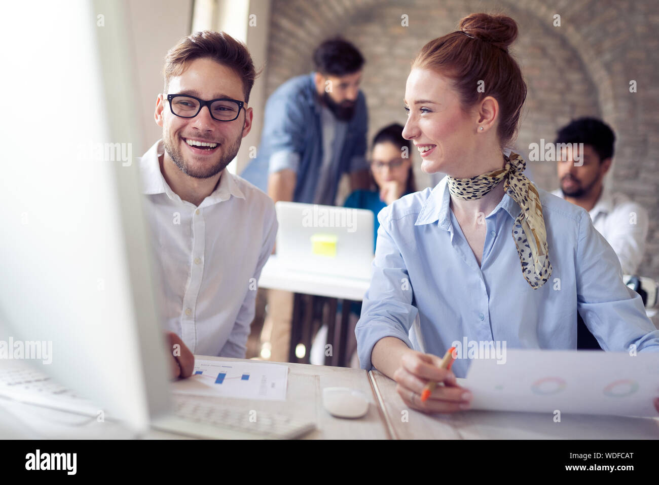 Happy creative team in office. Business, startup, design, people and ...