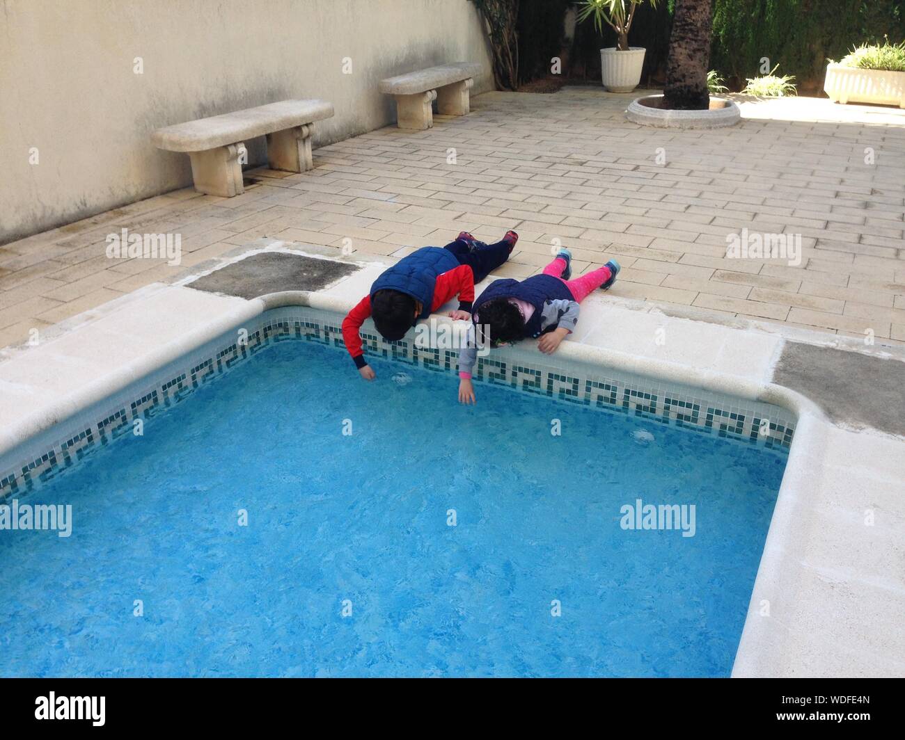 Boys Lying Pool High Resolution Stock Photography and Images - Alamy