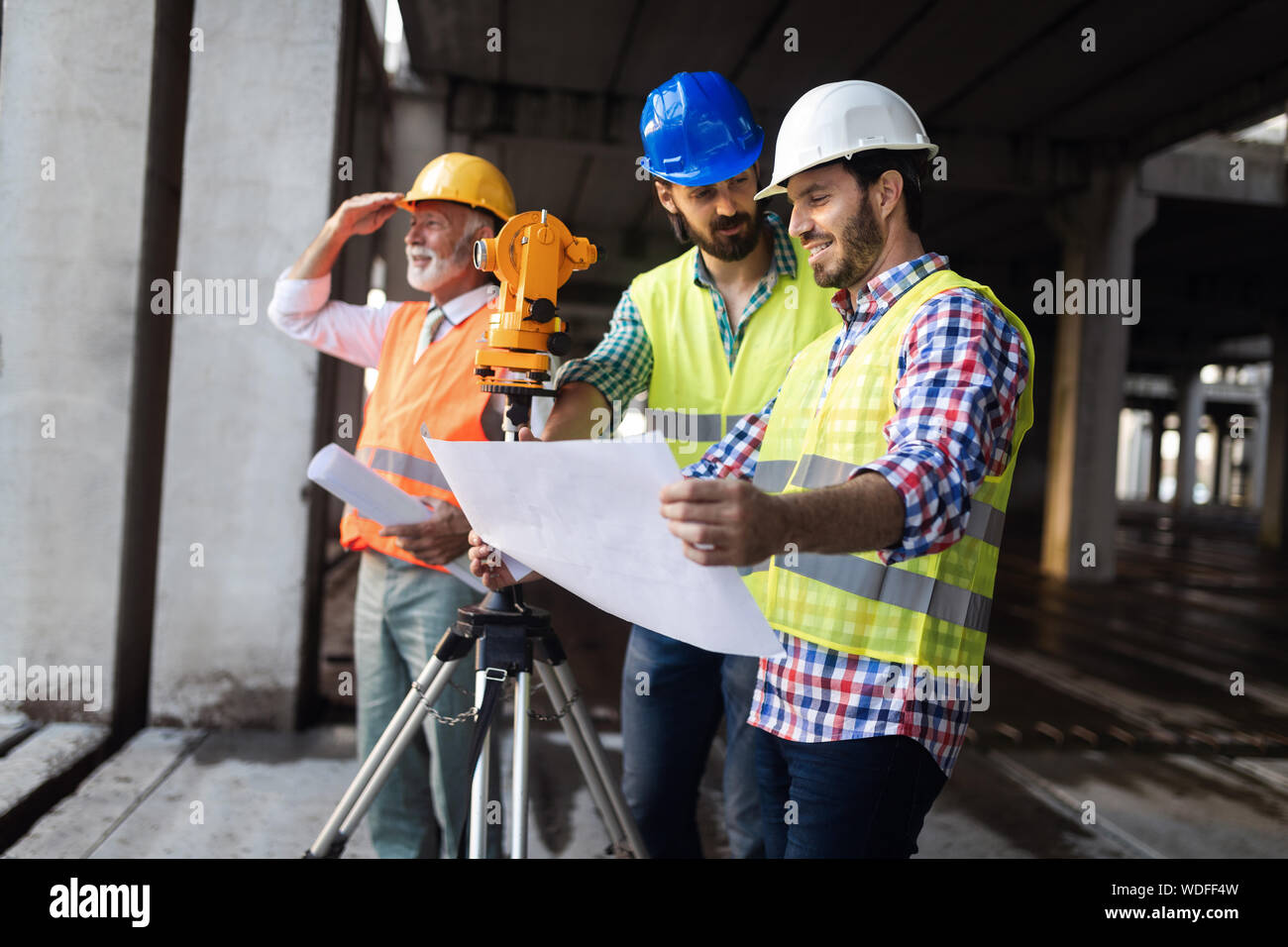 Group of construction engineer working in construction site Stock Photo ...