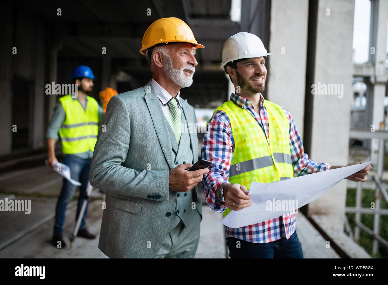 Group of construction engineer working in construction site Stock Photo ...