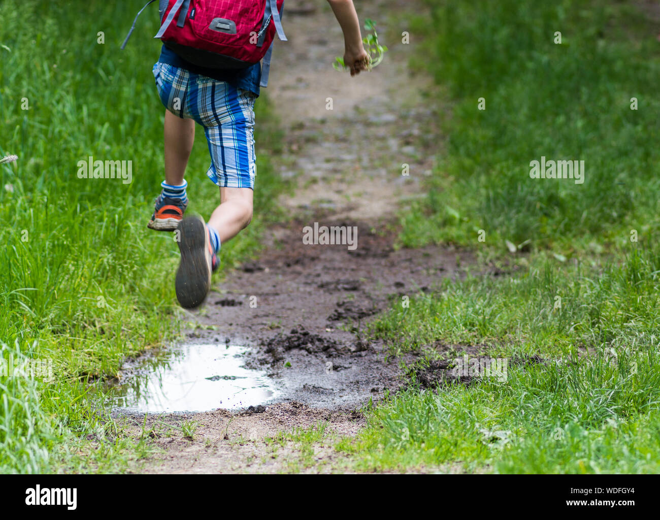 Jumping over puddle hi-res stock photography and images - Alamy