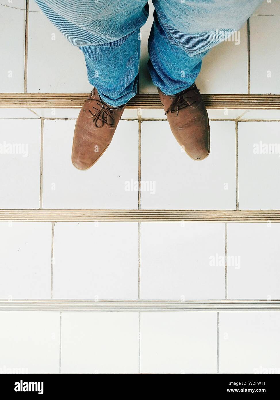 One leg on stairs hi-res stock photography and images - Alamy