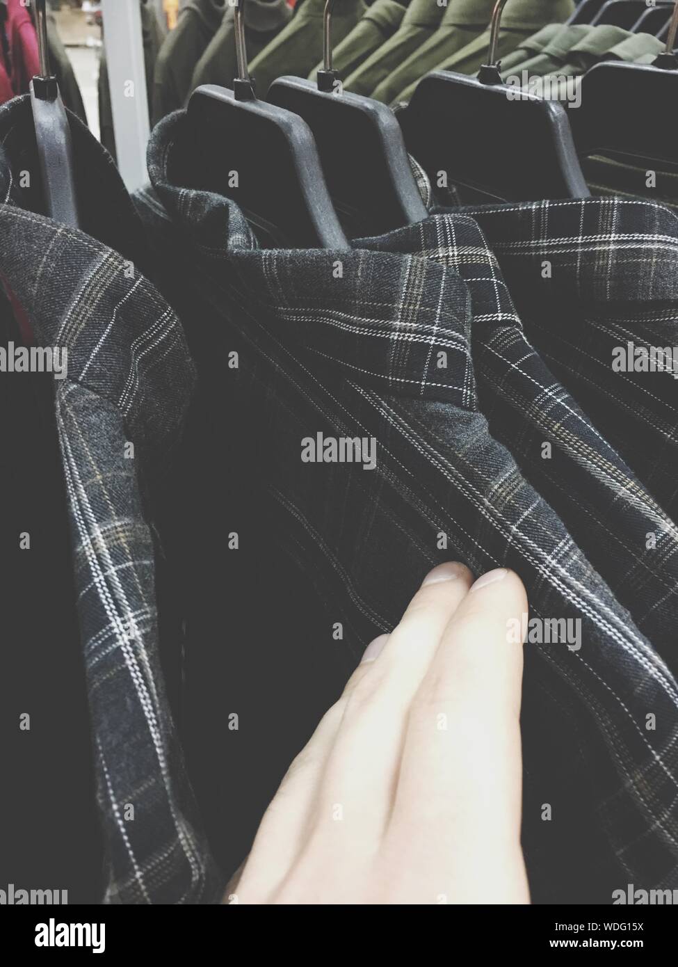 Hand holding shirt hi-res stock photography and images - Alamy