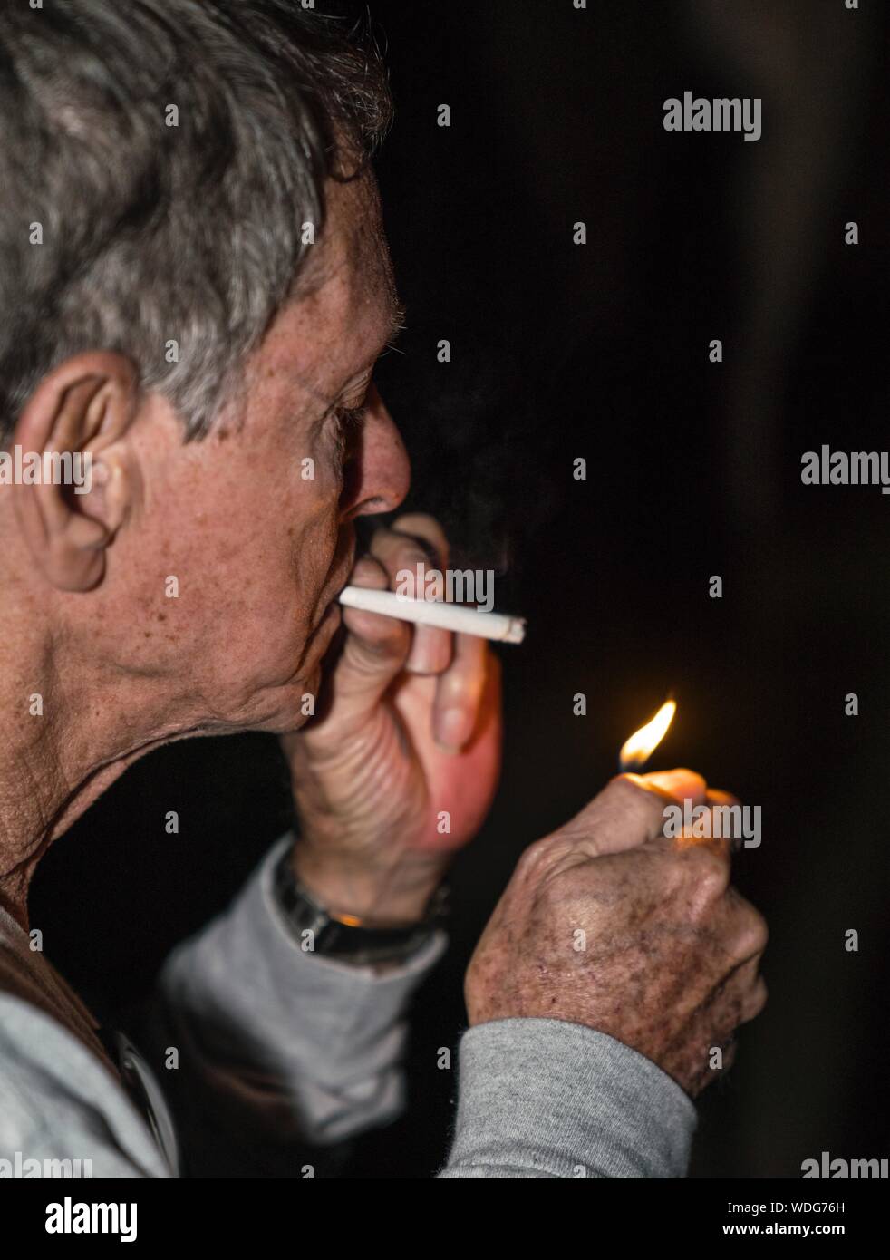 Man with lighter hi-res stock photography and images - Alamy