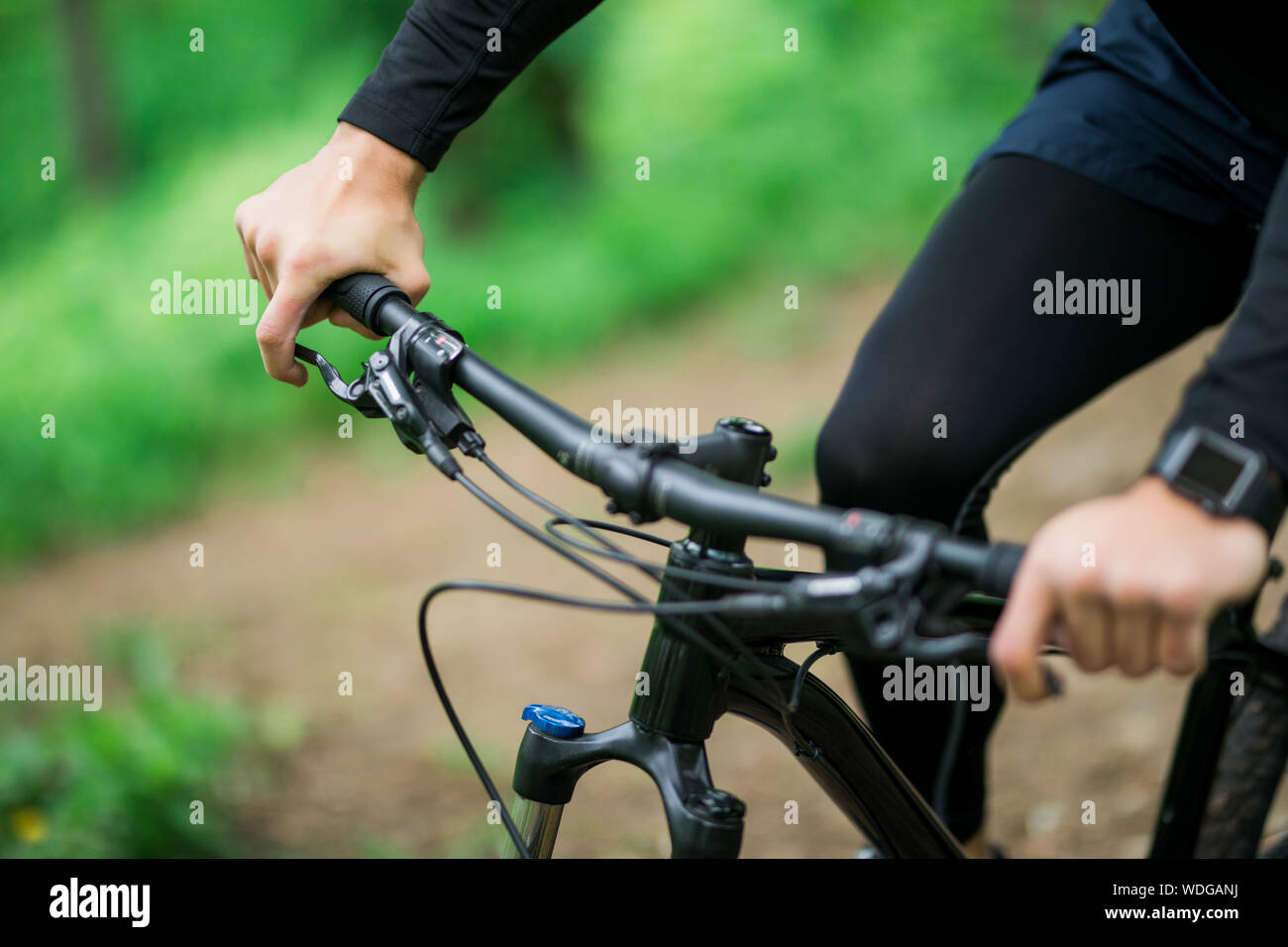Hands holding handlebar bicycle hi-res stock photography and images - Alamy