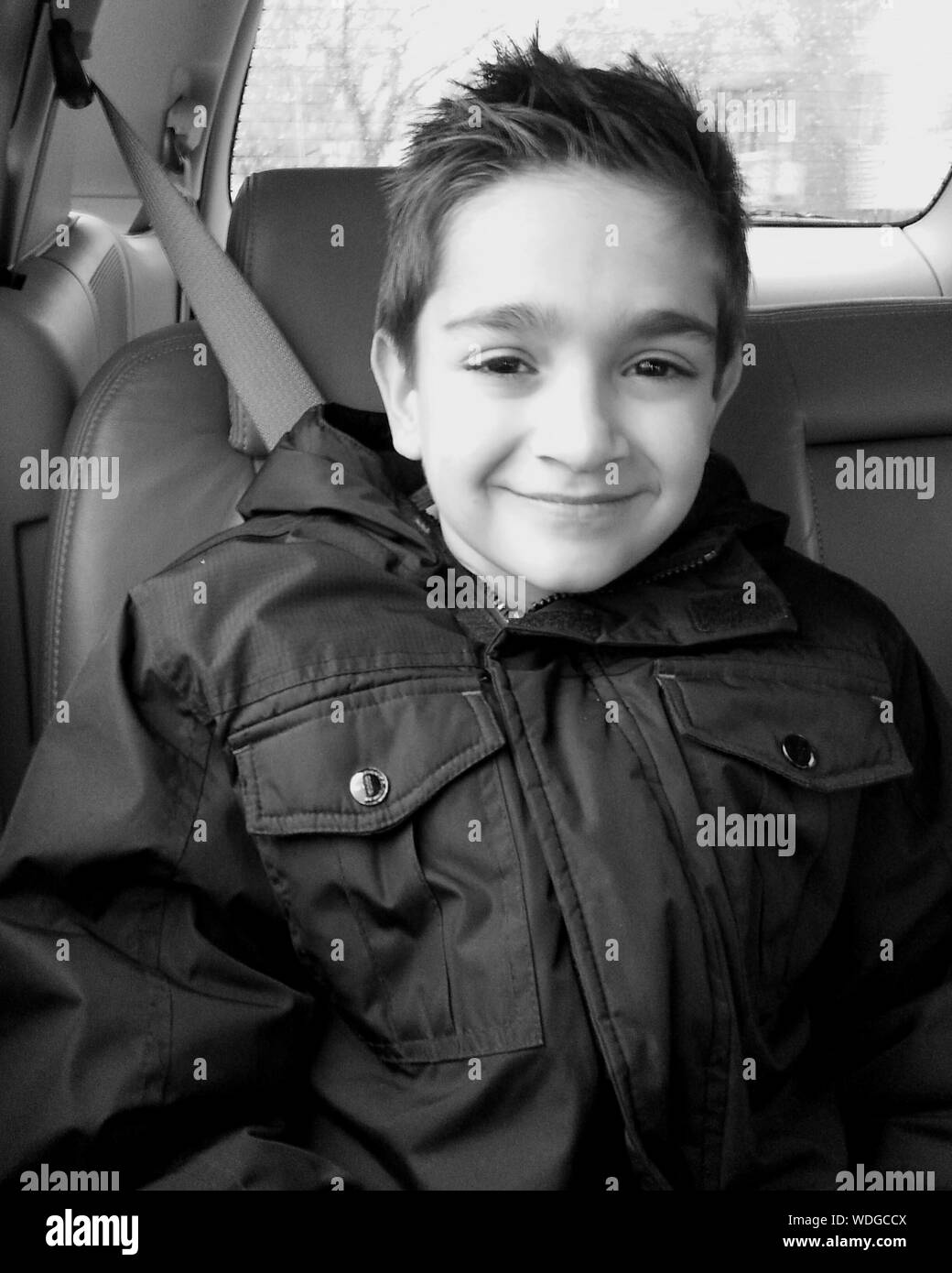 Child in car seat smiling hi-res stock photography and images - Alamy
