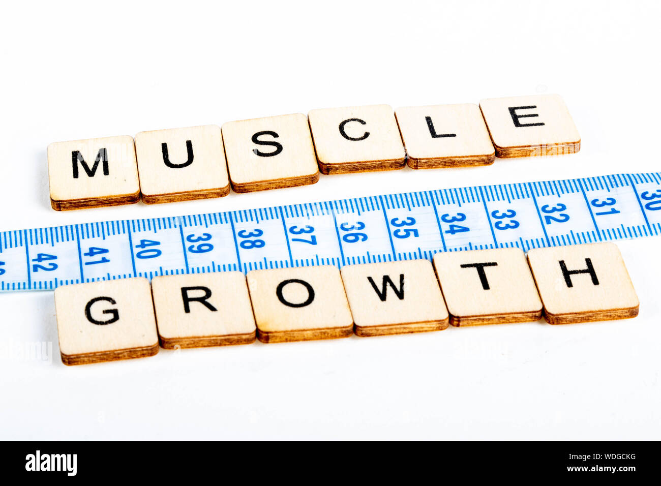 Health concept of a tape measure also showing the message Muscle Growth ...
