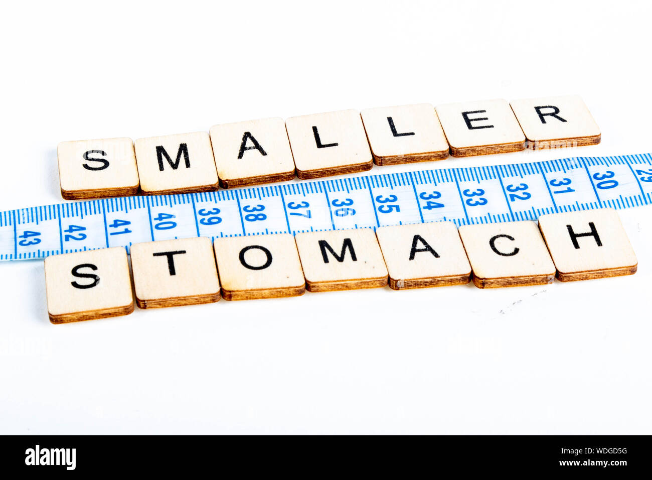 Health concept of a tape measure also showing the message Smaller ...