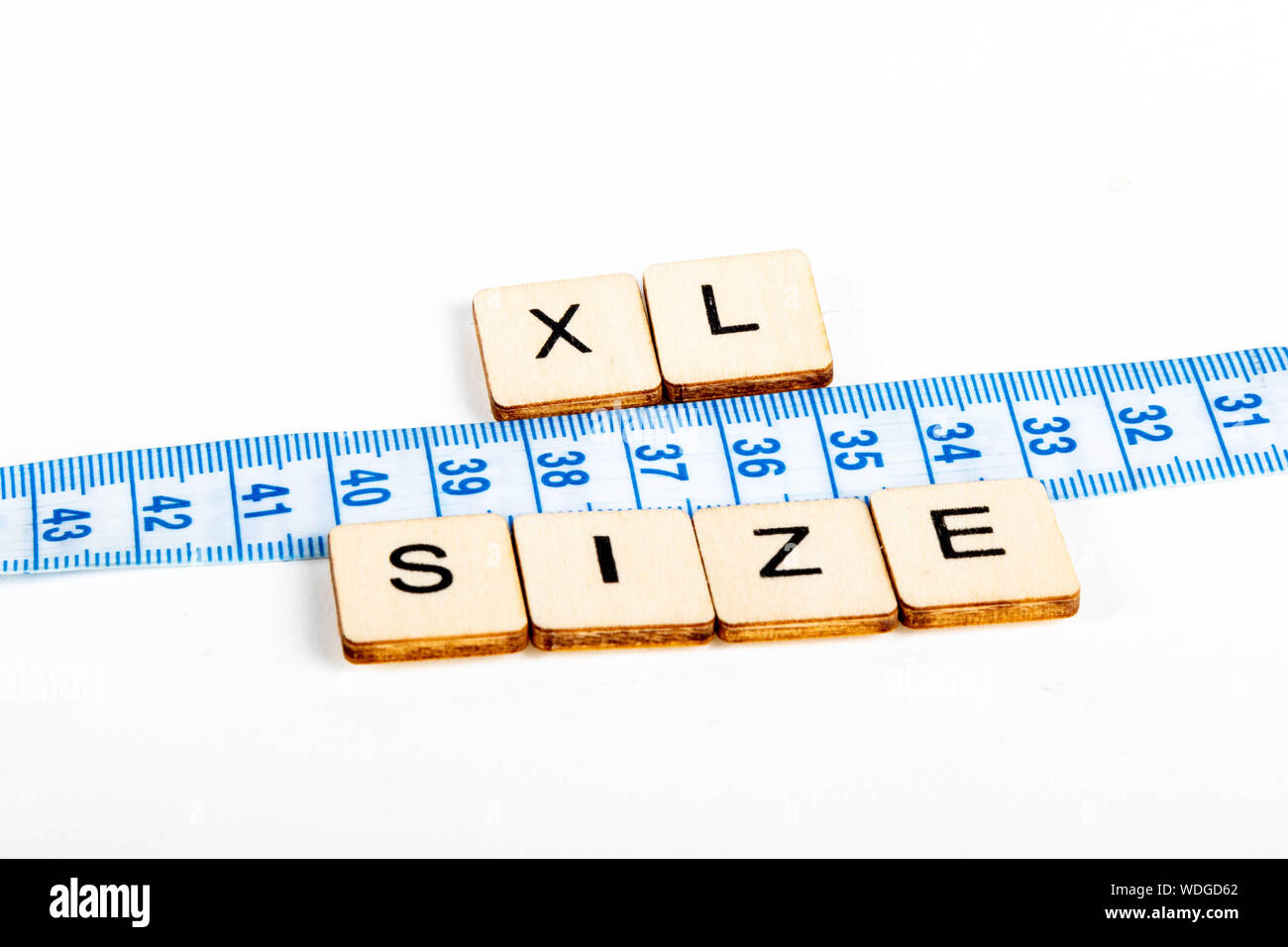 Health concept of a tape measure also showing the message XL Size Stock ...