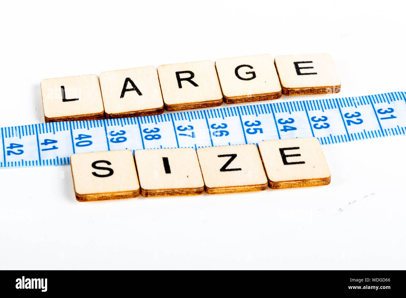 Health concept of a tape measure also showing the message Large Size ...