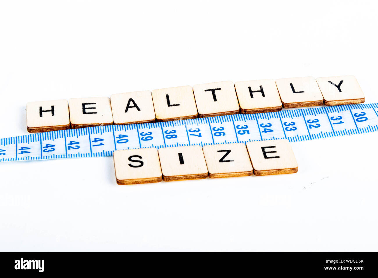 Health concept of a tape measure also showing the message Healthy Size ...