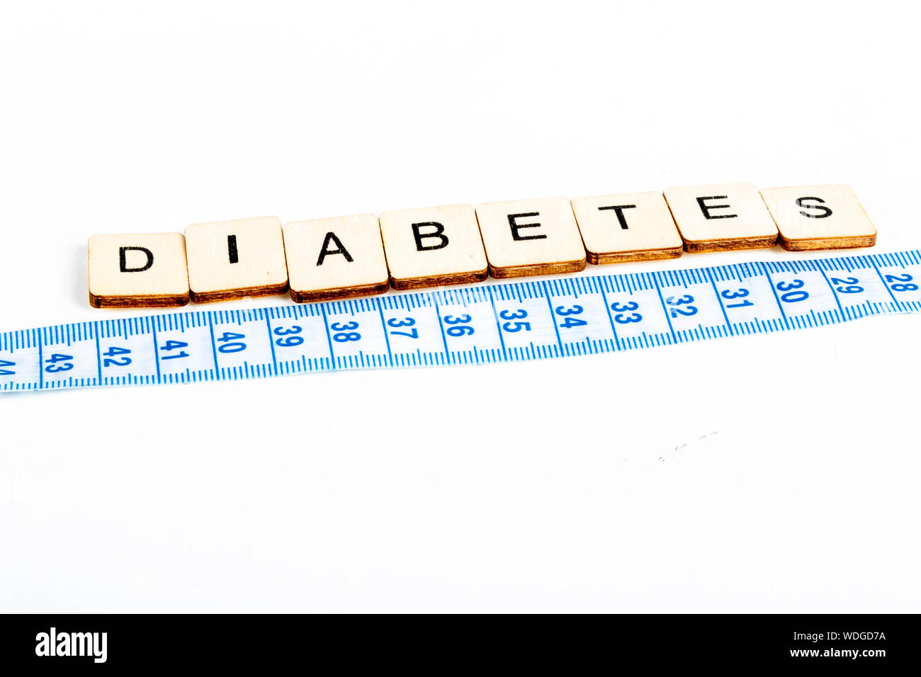 Health concept of a tape measure also showing the message Diabetes ...