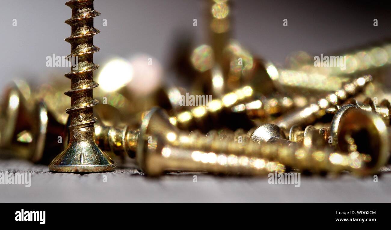Golden screw hi-res stock photography and images - Alamy