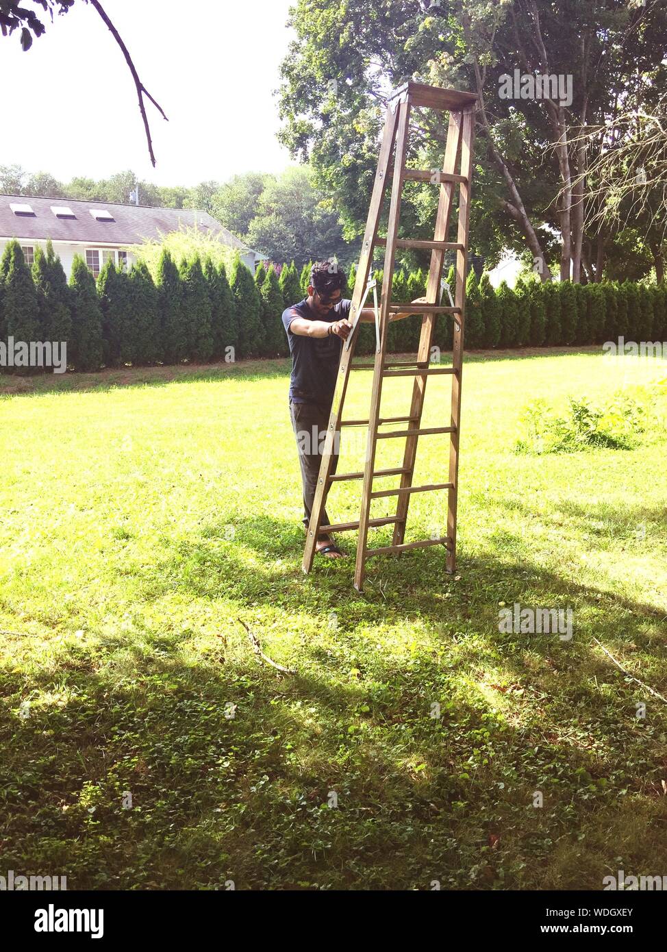 Ladder Holding Men High Resolution Stock Photography and Images - Alamy