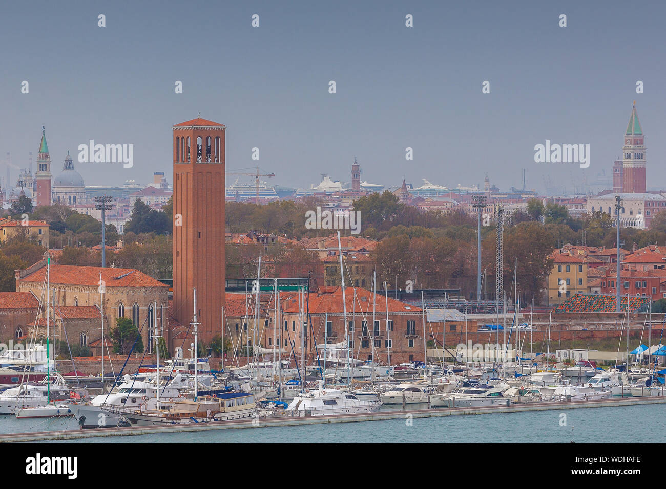 Boats in the marina of island of Sant'Elena and football stadium ...