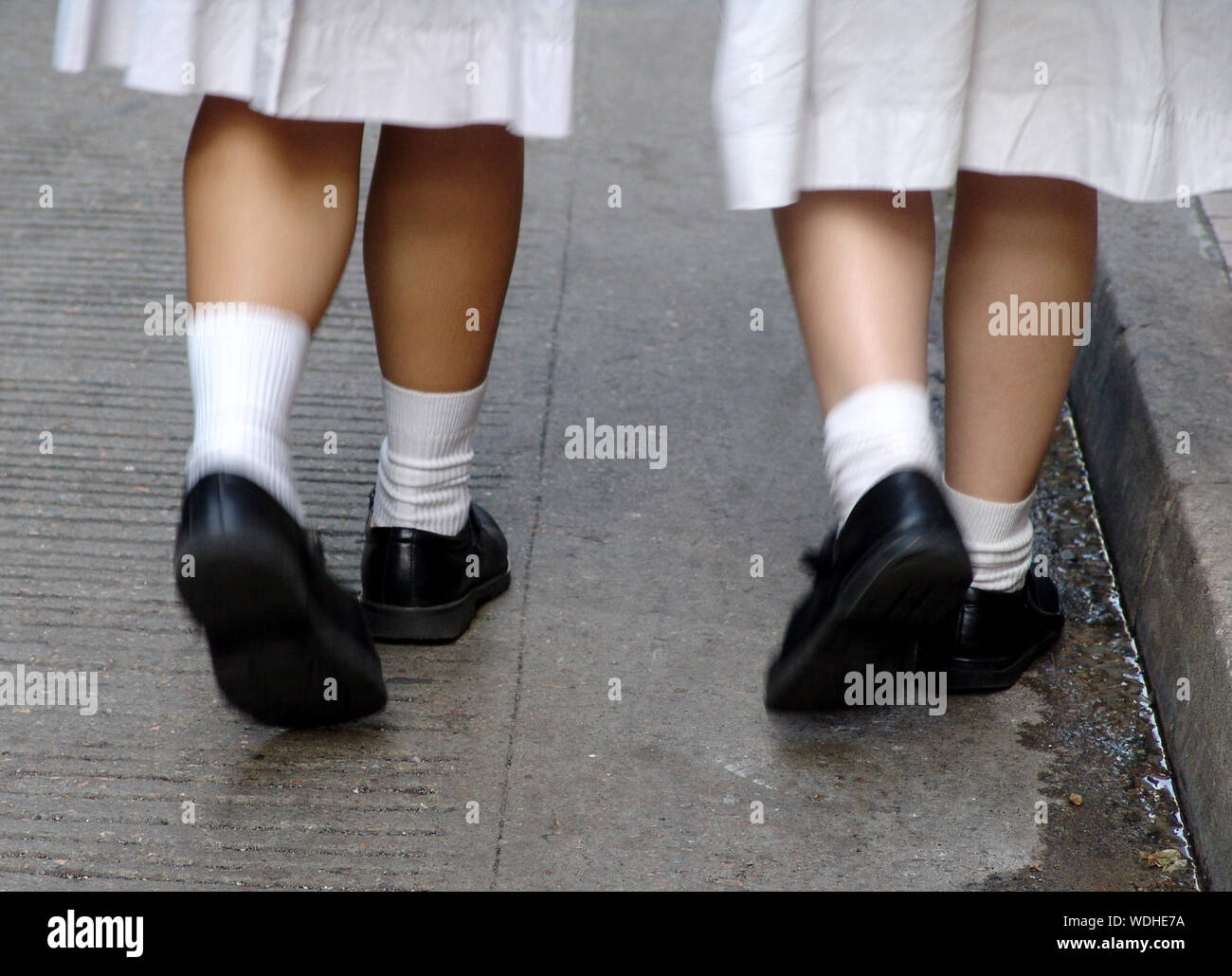 Two girls wearing school uniform hi-res stock photography and images ...