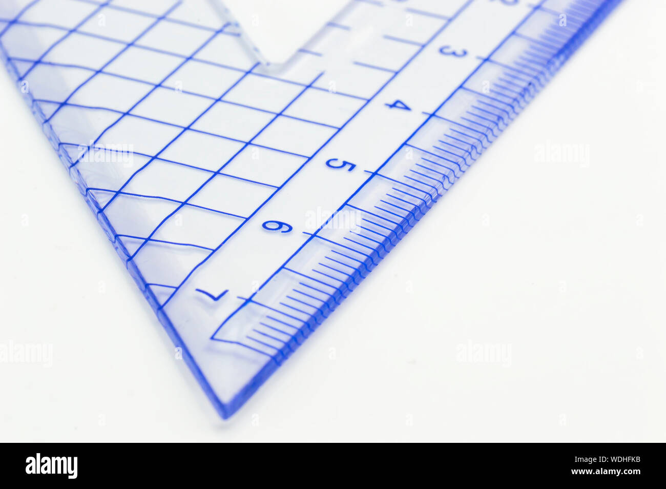 Close-up Of Set Square Over White Background Stock Photo - Alamy