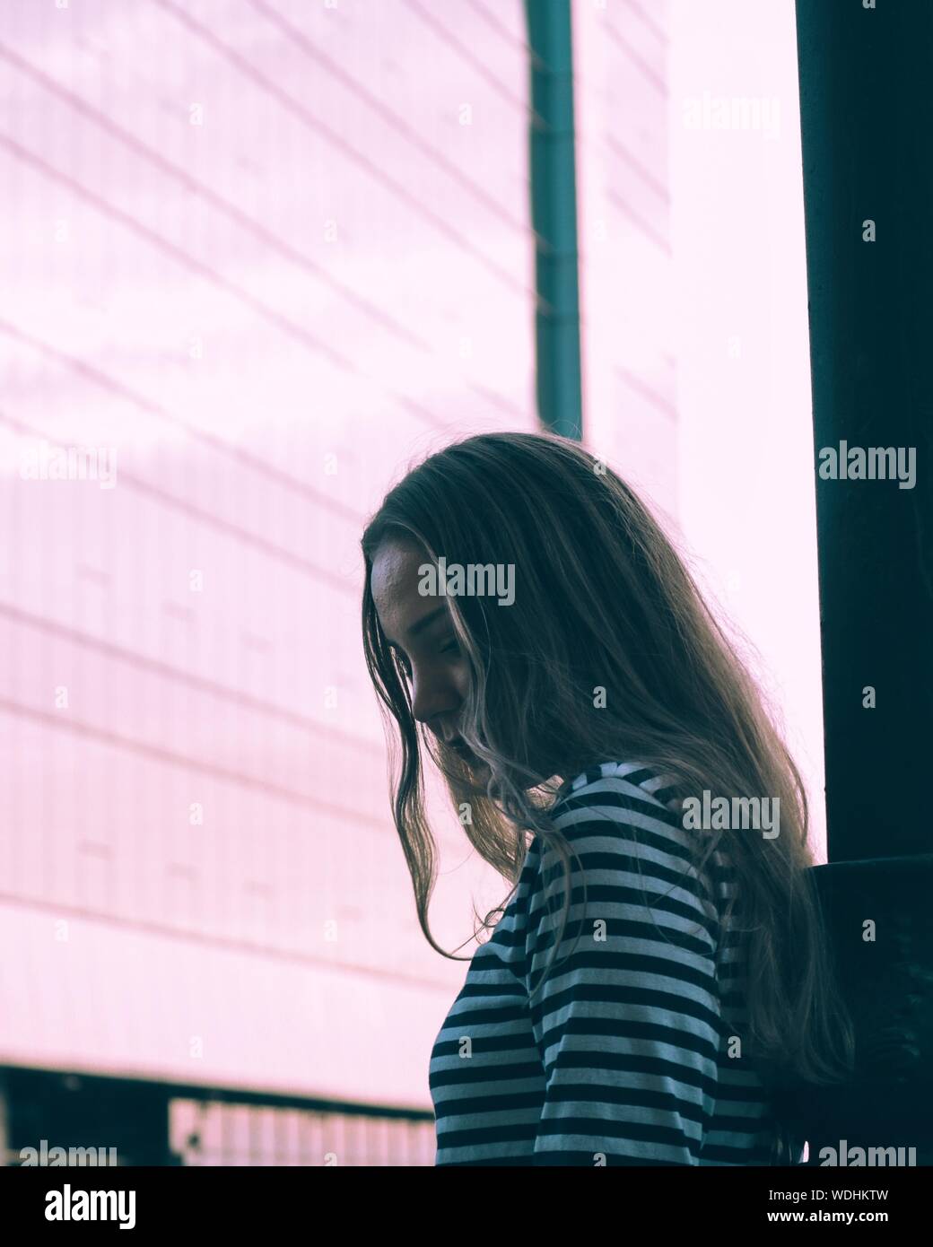 Leaning Against Pole High Resolution Stock Photography and Images - Alamy