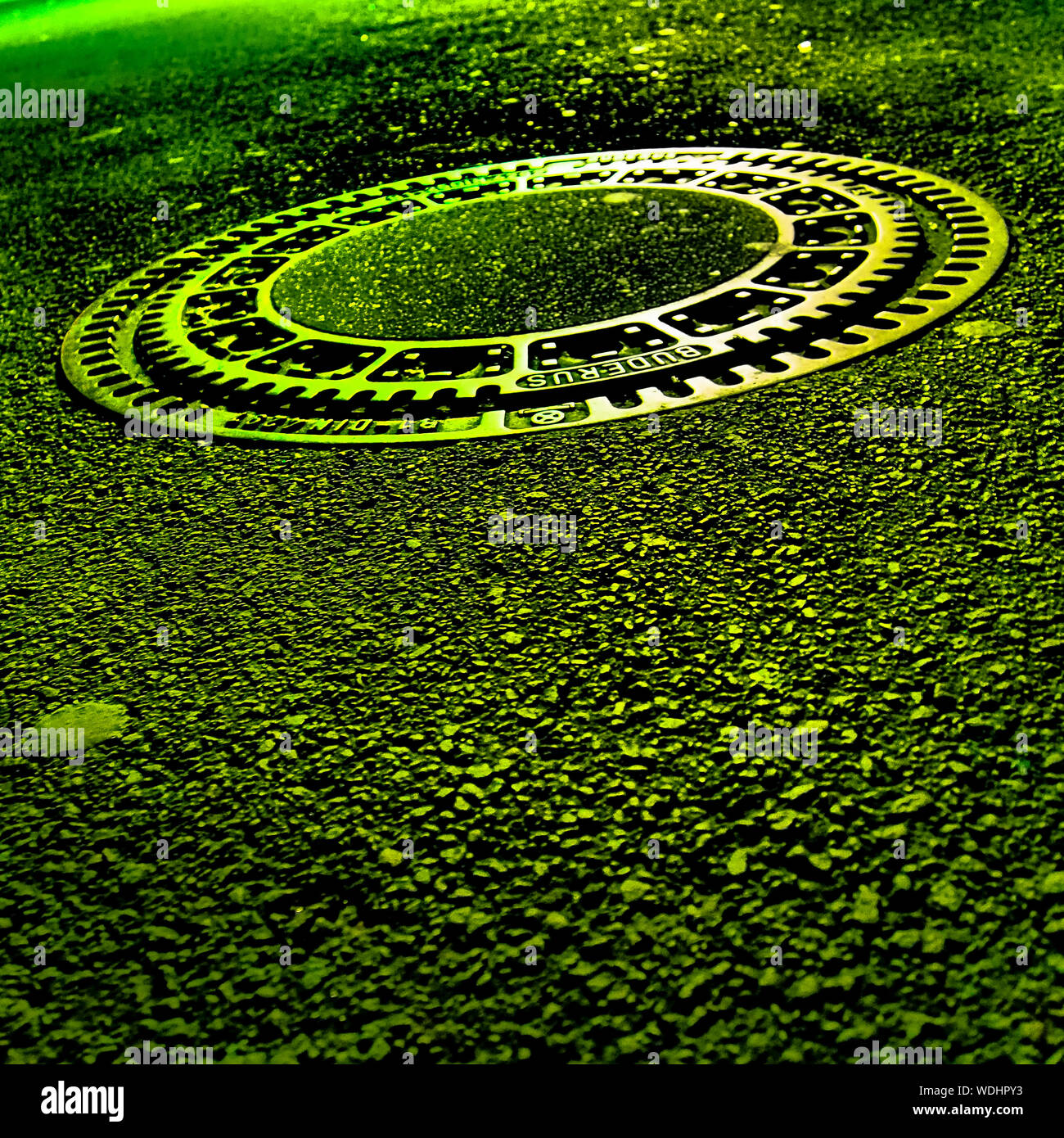 Green manhole cover hi-res stock photography and images - Alamy