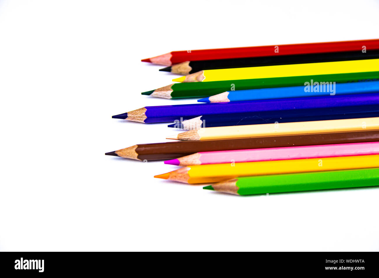 Multi-colored pencils for drawing on a white background. School ...