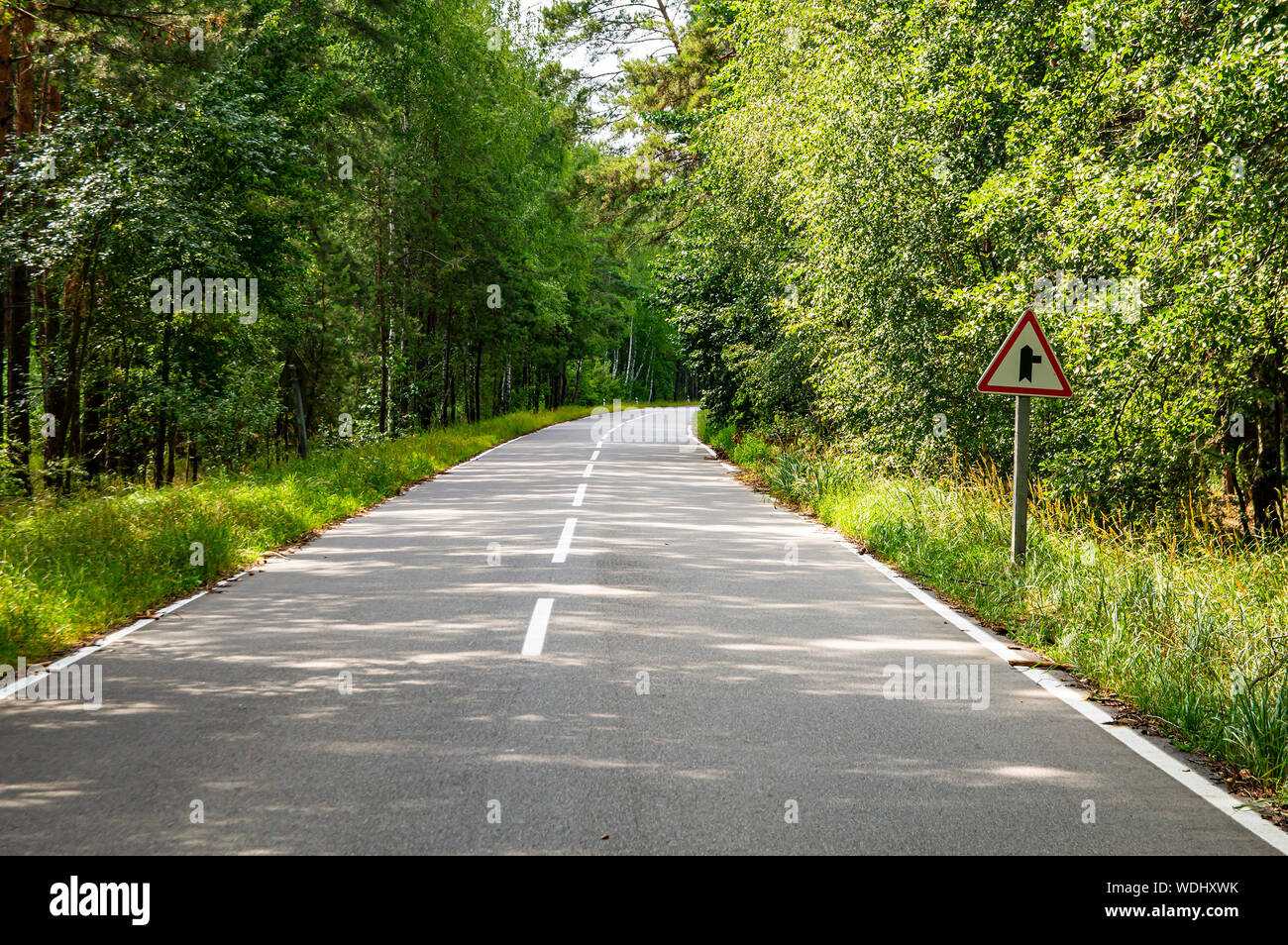 Rotate the road in the forest. Background Stock Photo - Alamy