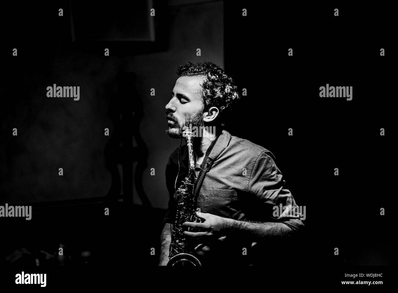 Man standing with musical instrument hi-res stock photography and ...