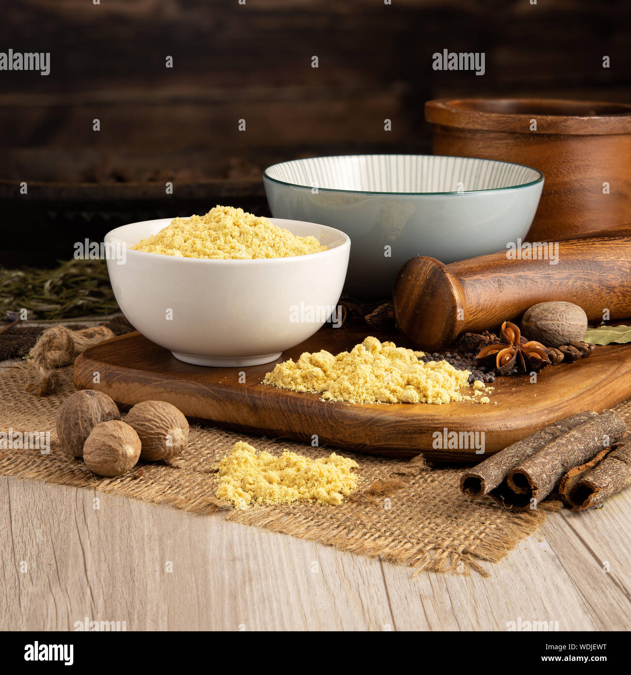 YELLOW MUSTARD POWDER in a bowl and food preparation and kitchen set ...