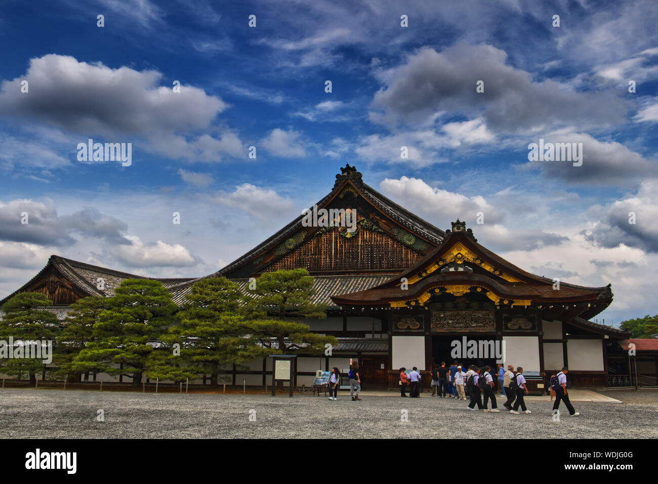 Tourists approaching the palace entrance at Nijo Castle, Kyoto, Japan ...