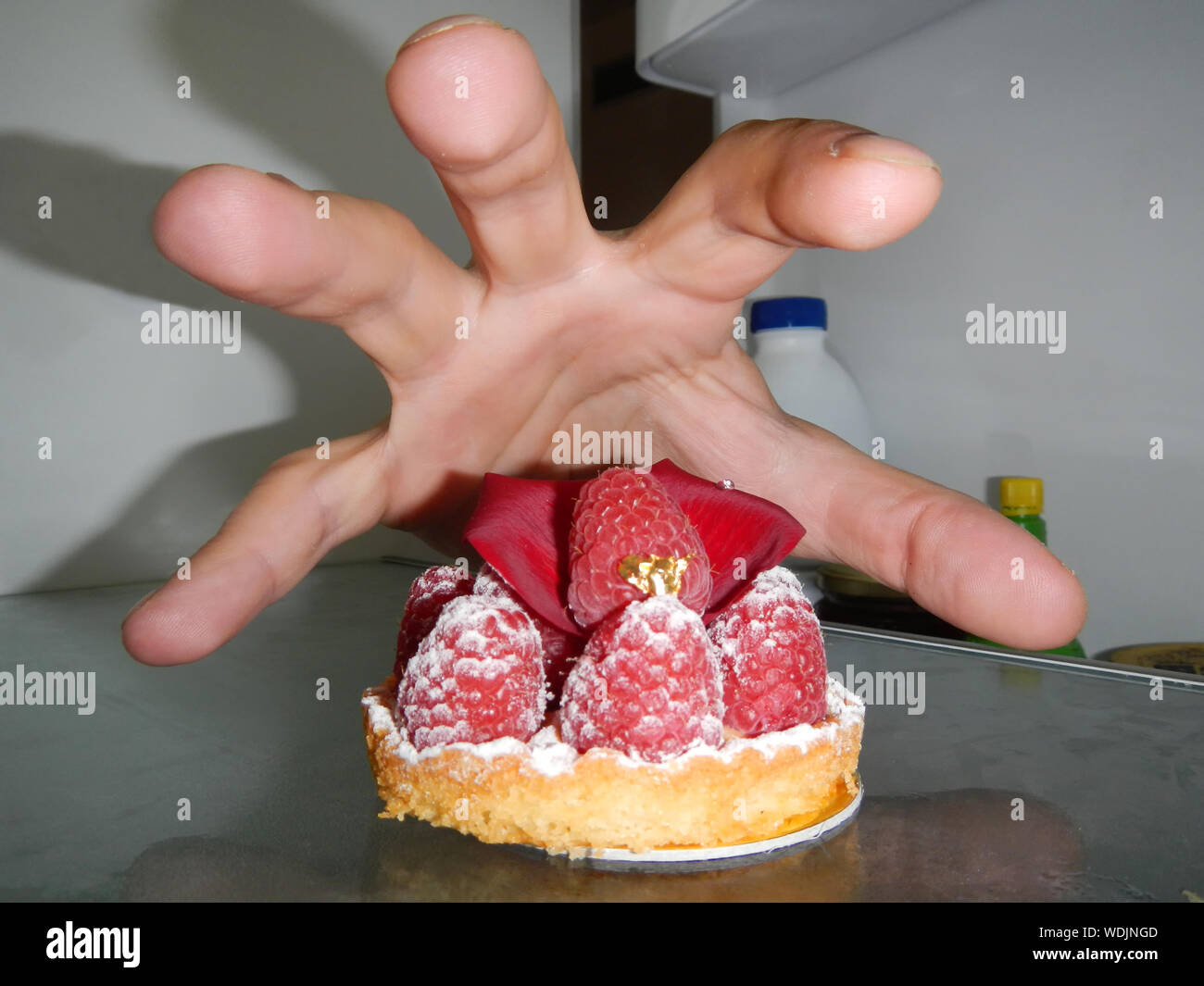 Reaching for cake hi-res stock photography and images - Alamy