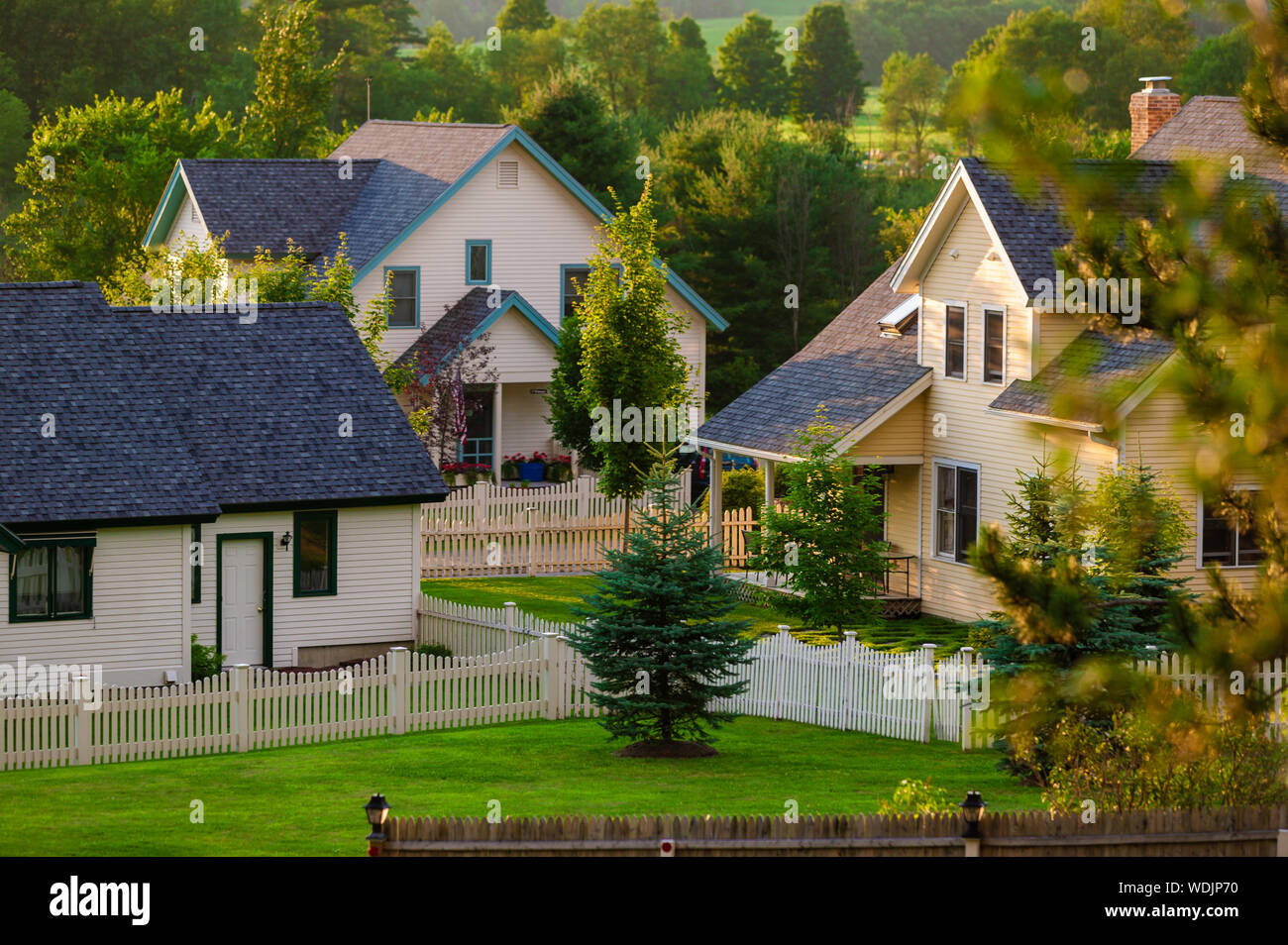 Three rural homes with white picket fences in Stowe Vermont, USA Stock ...