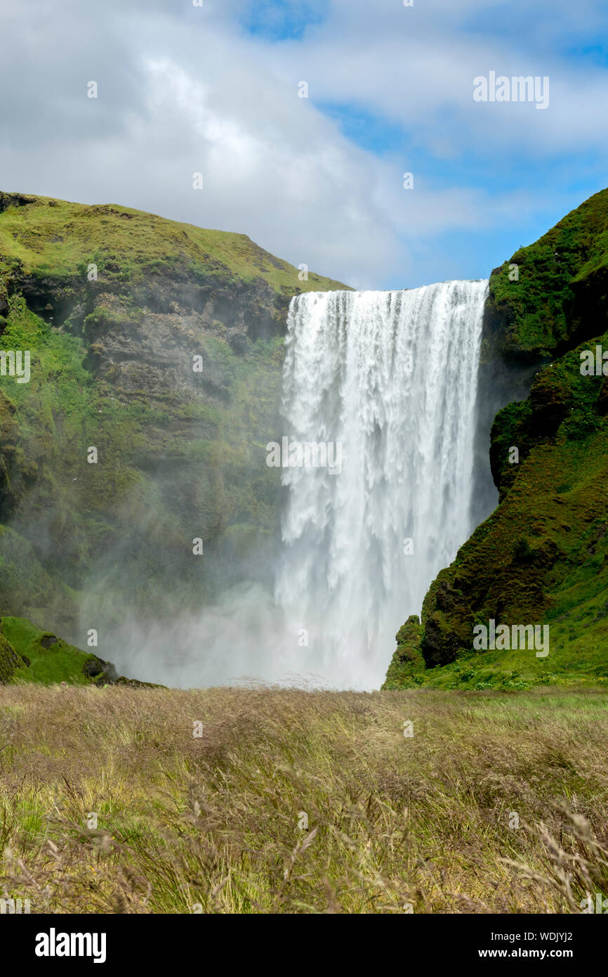 Skogafoss steep waterfall in the South of Iceland on a sunny day in ...