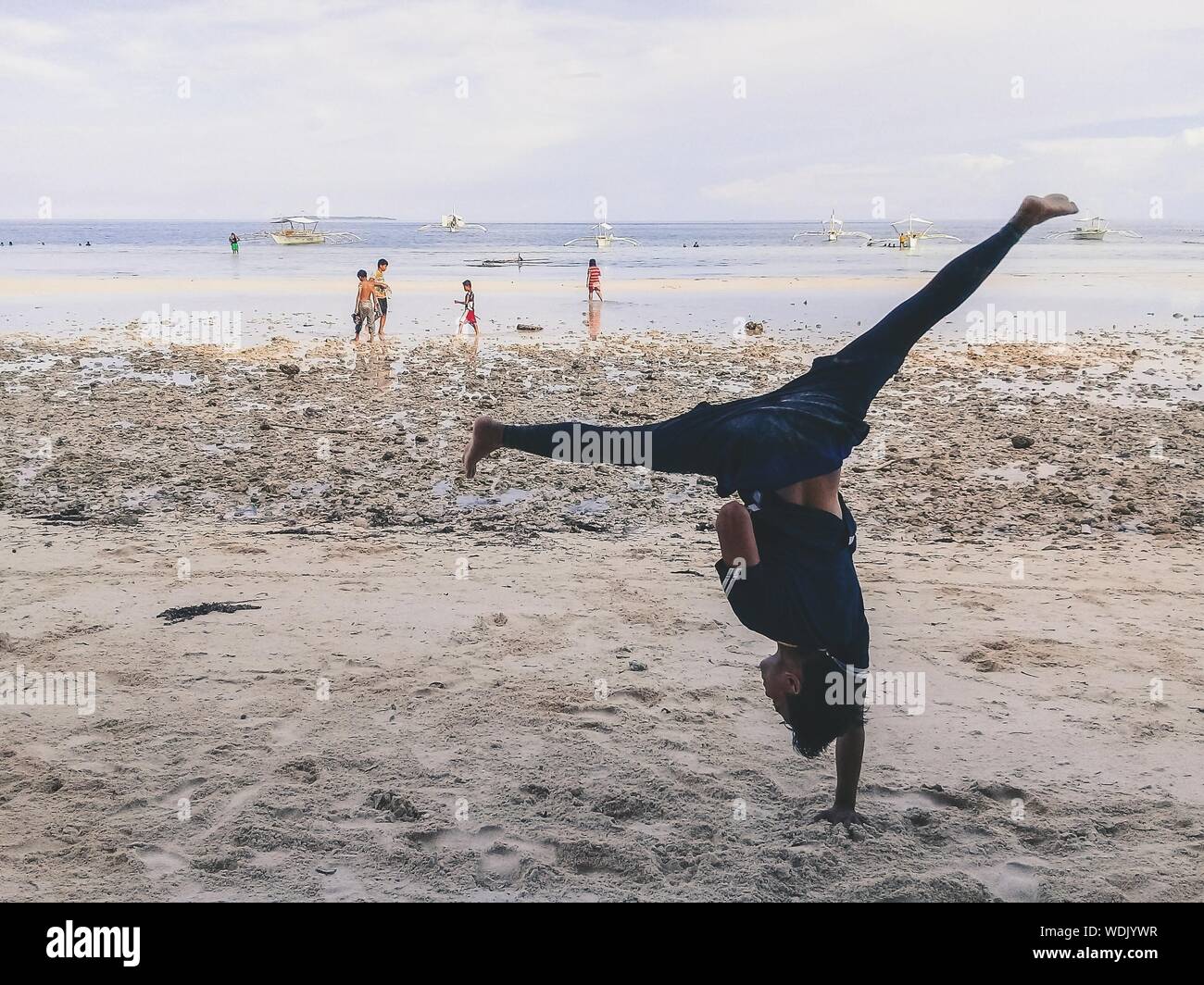 Doing handstand in sea hi-res stock photography and images - Alamy