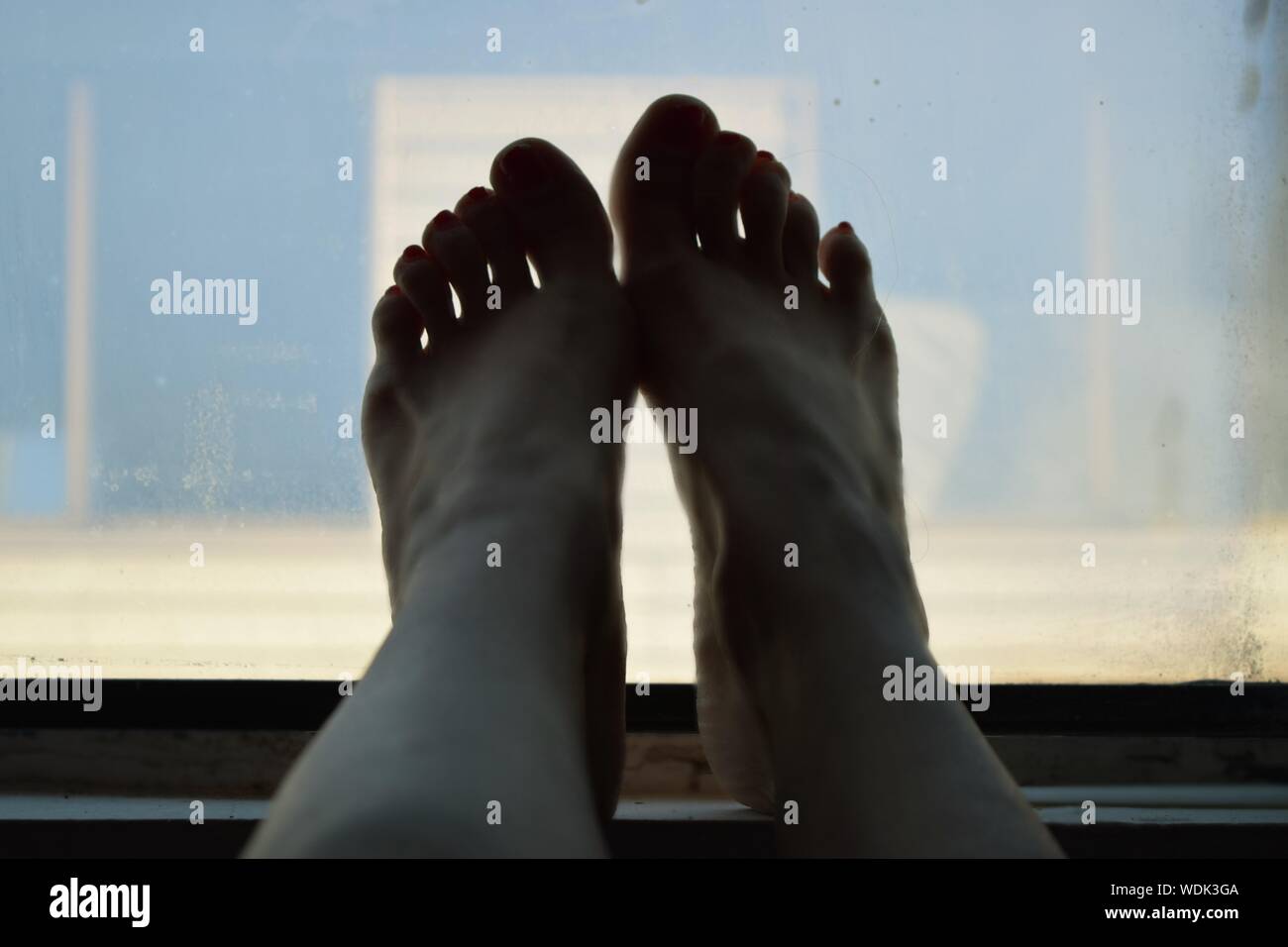 Window and feet hi-res stock photography and images - Alamy