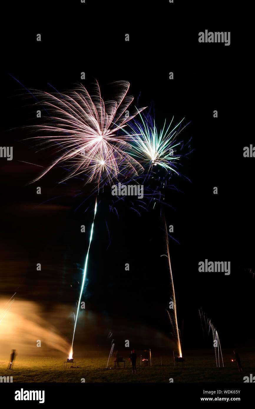 Long exposure of people letting off fireworks Stock Photo - Alamy