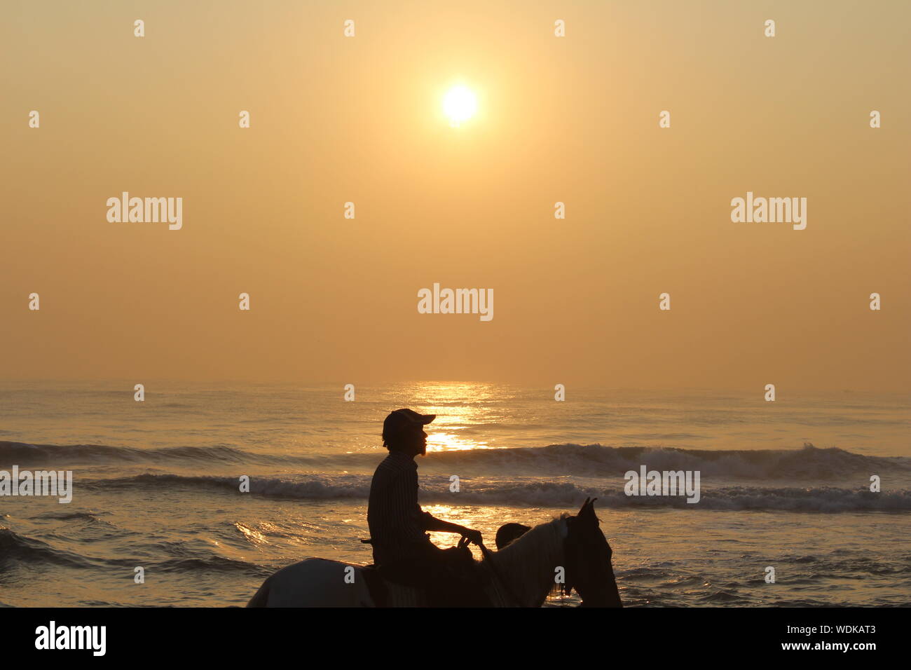 Silhouette man horse against sunset hi-res stock photography and images ...