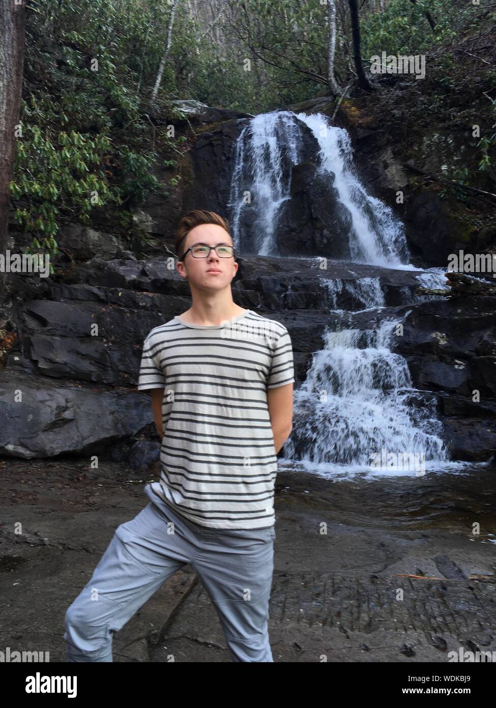 Boy by waterfall hi-res stock photography and images - Alamy