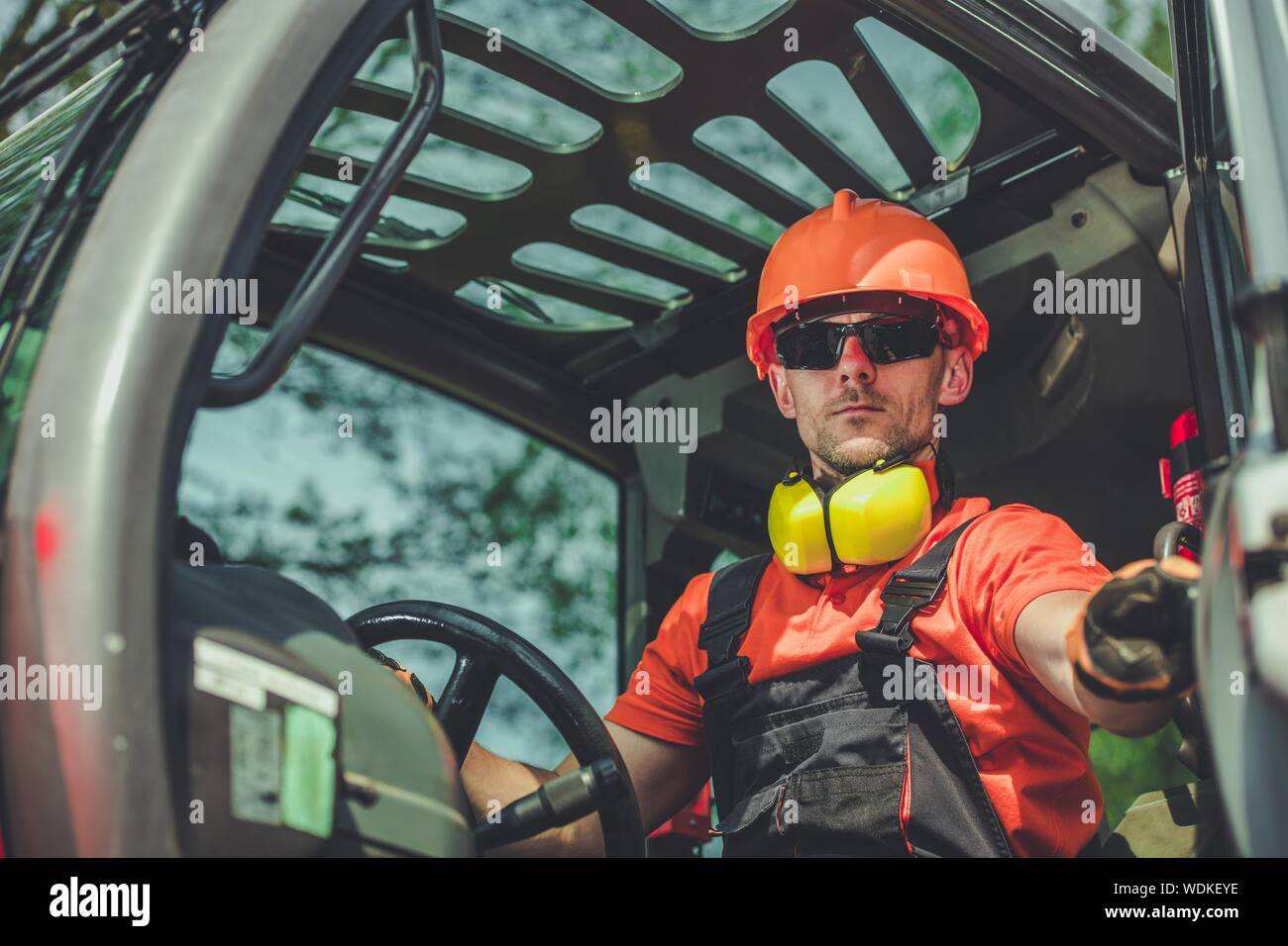 Construction Machine Operator. Caucasian Worker Inside Modern ...