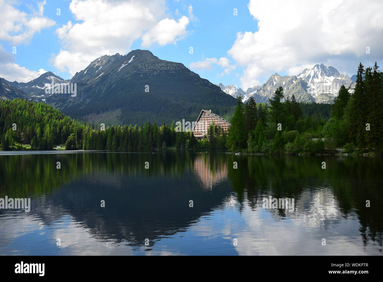 The lake Strbské pleso and the Hotel Patria, with the peaks of the High ...